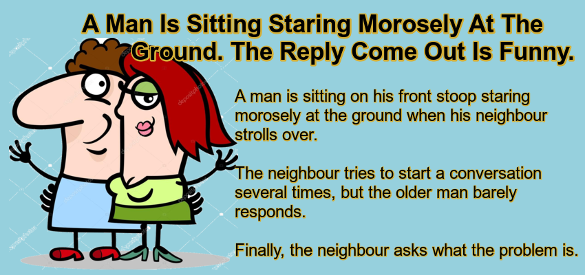 A Man Is Sitting Staring Morosely At The Ground.